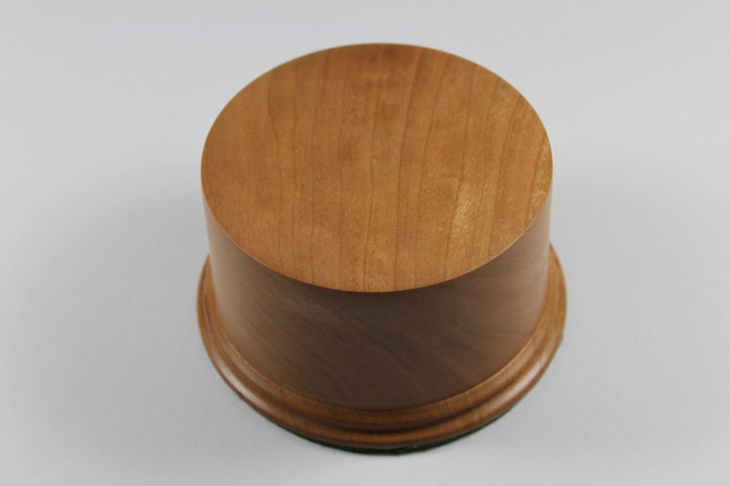 A solid wood Base made from American Cherry 50mm High with a display ...